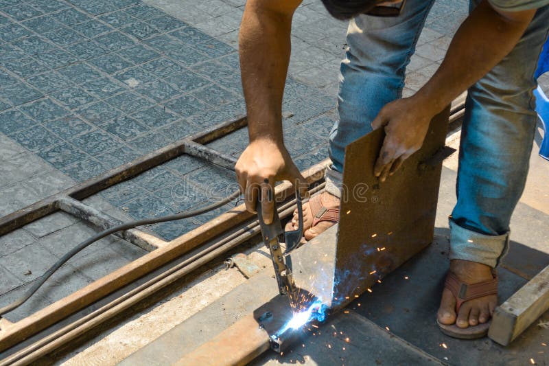 Welding Man at Work in the Rolling Shutter Factory Stock Image - Image ...