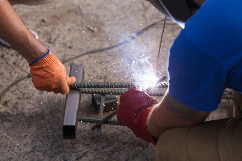 Welding of Metal Fittings by a Working Stock Image - Image of industry ...