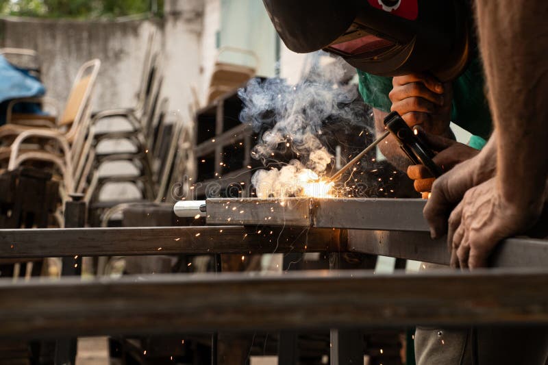 Welding Metal Parts with Sparks and Smoke - Welder S Work Process ...