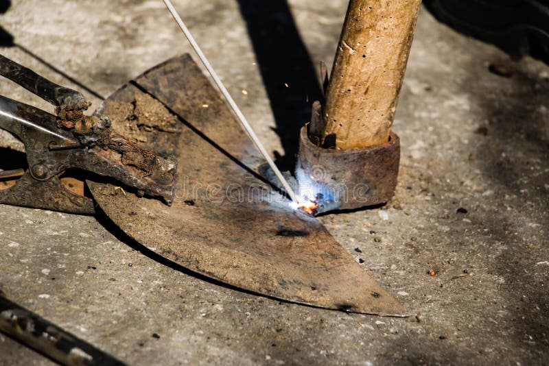 Welding Old Broken Hoe with Electrocautery Stock Photo - Image of ...