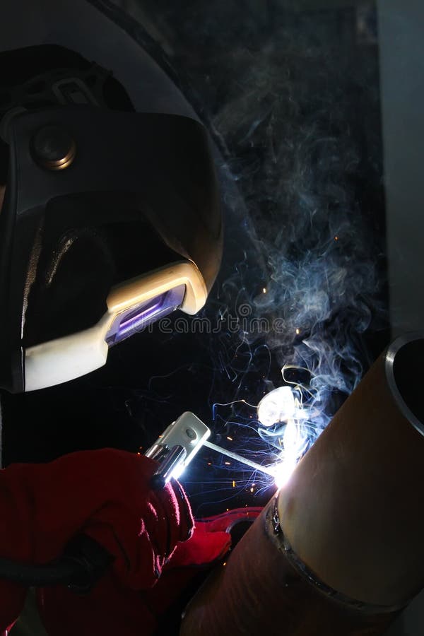 Welding pipe stock image. Image of light, safety, craftsperson - 99049879
