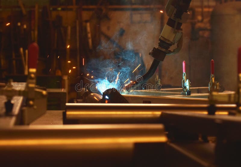 Welding Robot and Machine in Factory Work Welding Steel Joint. Stock ...