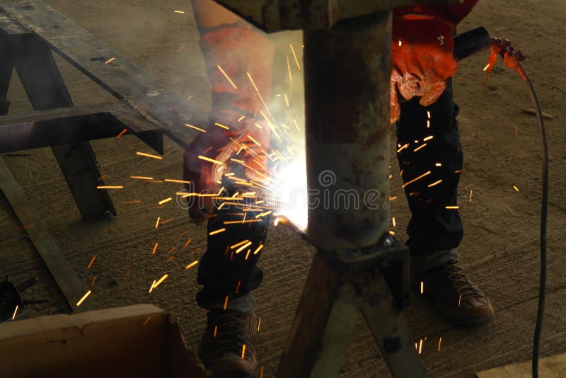 Welding two metal sparks stock image. Image of games - 261011635