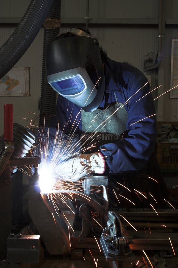 Welding a Car Part in Factory Stock Image - Image of fumes, blue: 5289675