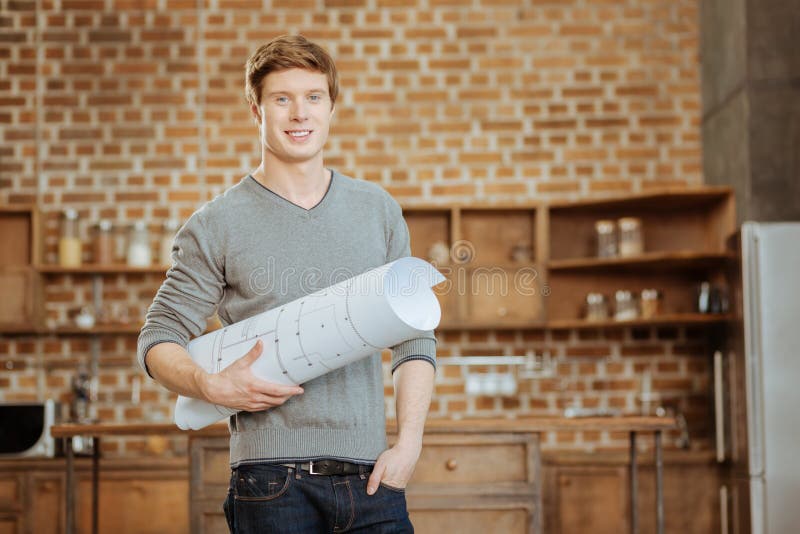 Well-built Engineer Posing with a Blueprint Stock Photo - Image of ...