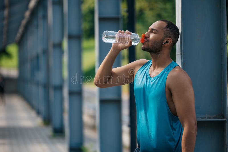 Well-built Handsome Sportsman Drinking Water after Workout Stock Photo ...