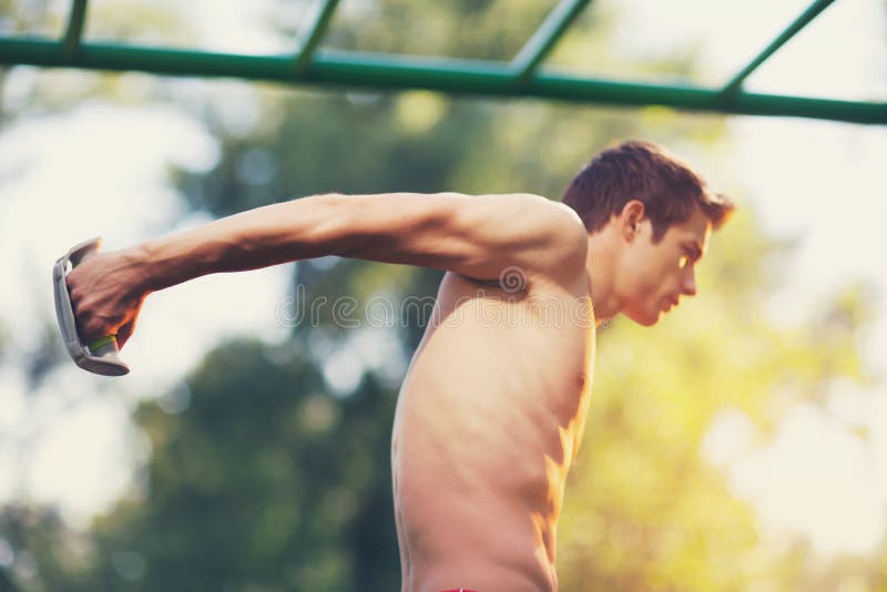 Well Built Muscular Man Doing a Physical Exercise Stock Image - Image ...