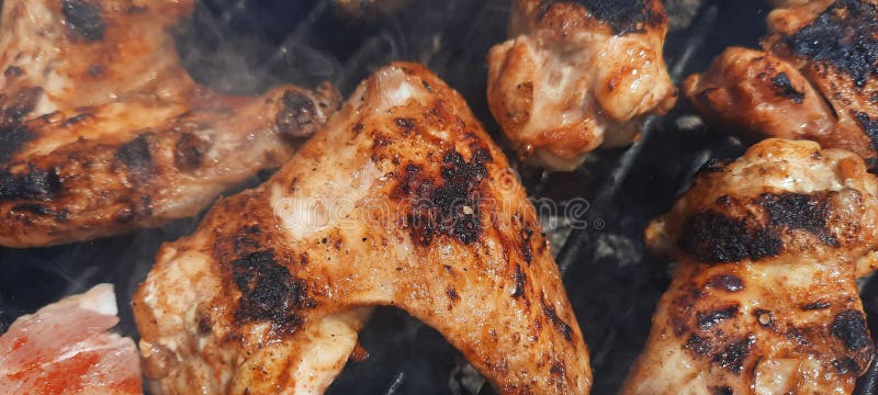 Well cooked chicken wings stock image. Image of grilling - 249371547