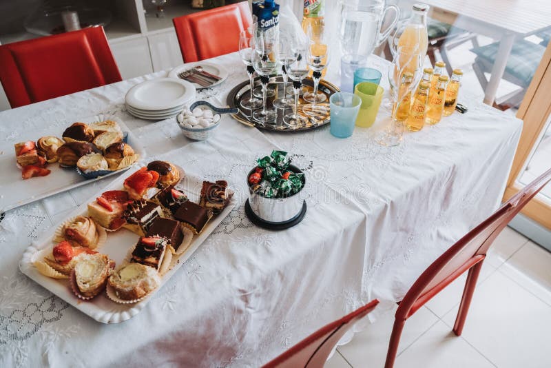 Well-designed Table in Bolzano Full of Sweets and Drinks Editorial ...