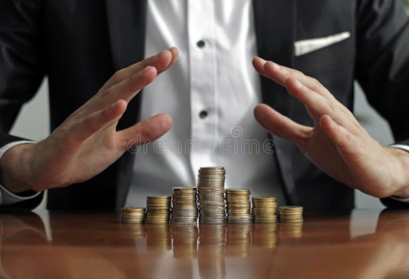 Well-dressed Male with His Hands Around the Stack of Coins Stock Image ...