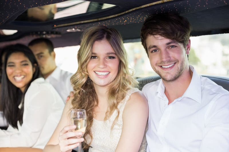 Well Dressed People Drinking Champagne in a Limousine Stock Image ...