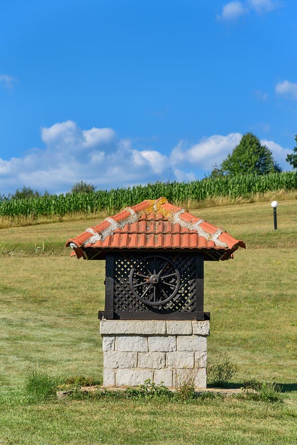 A well in the field stock photo. Image of horizontal - 262066806