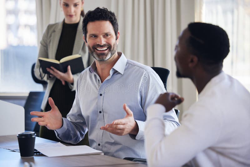 Well Figure it Out. Two Businesspeople in a Meeting at Work. Stock ...