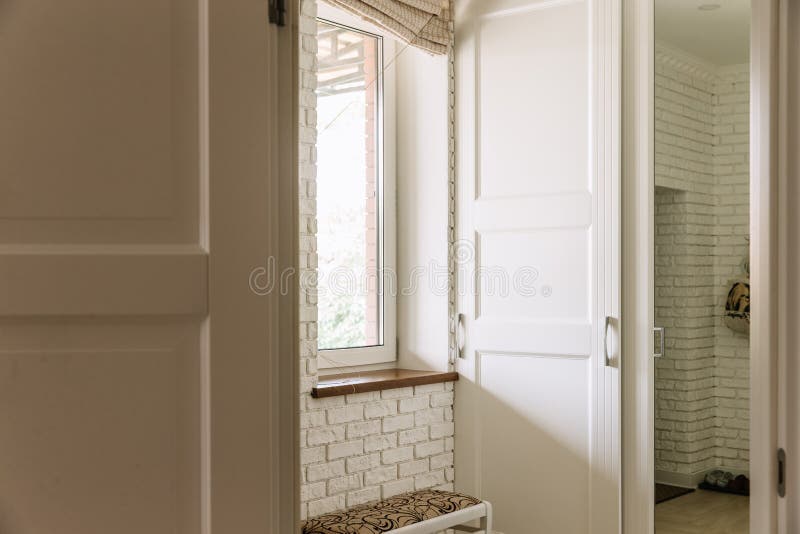 Well Illuminated Corridor with the Window on the Left Wall and the ...