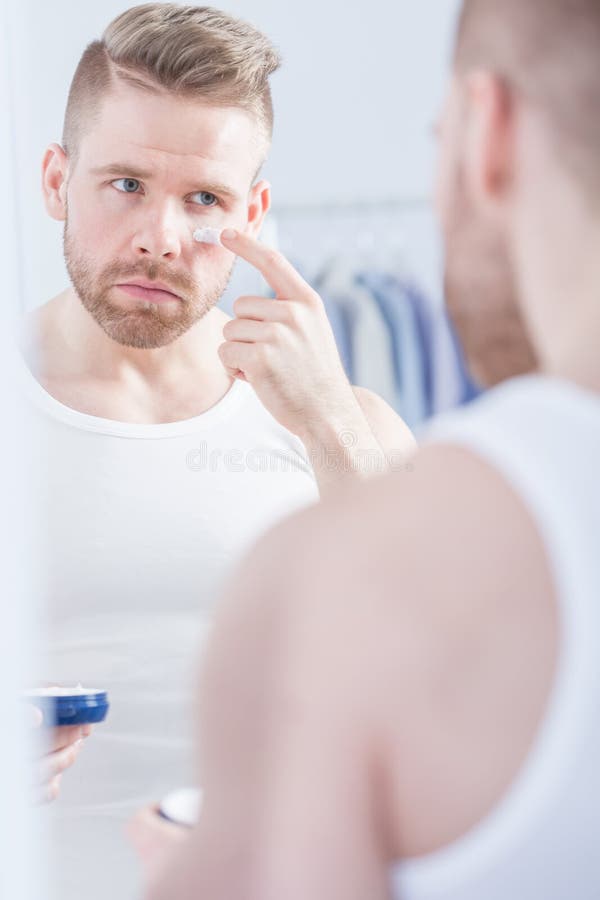 Well Kempt Man Applying Cream Stock Image - Image of attractive ...