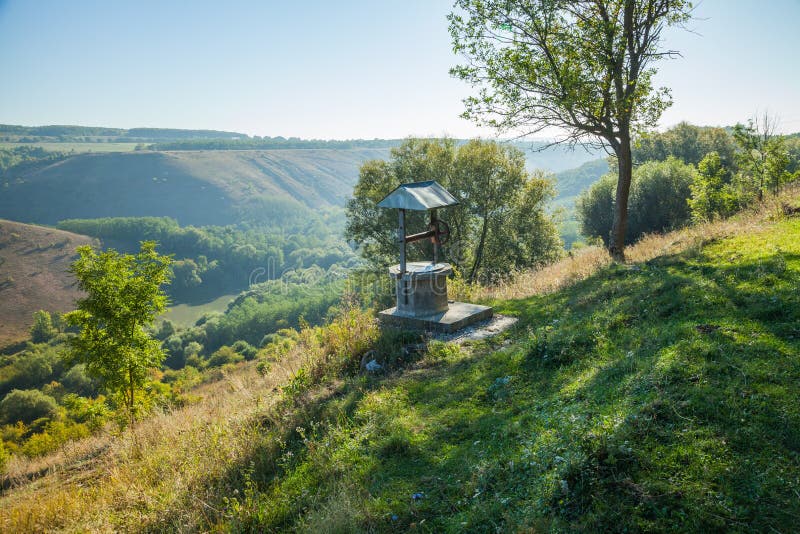 Well on top of the canyon stock image. Image of pulley - 81523211