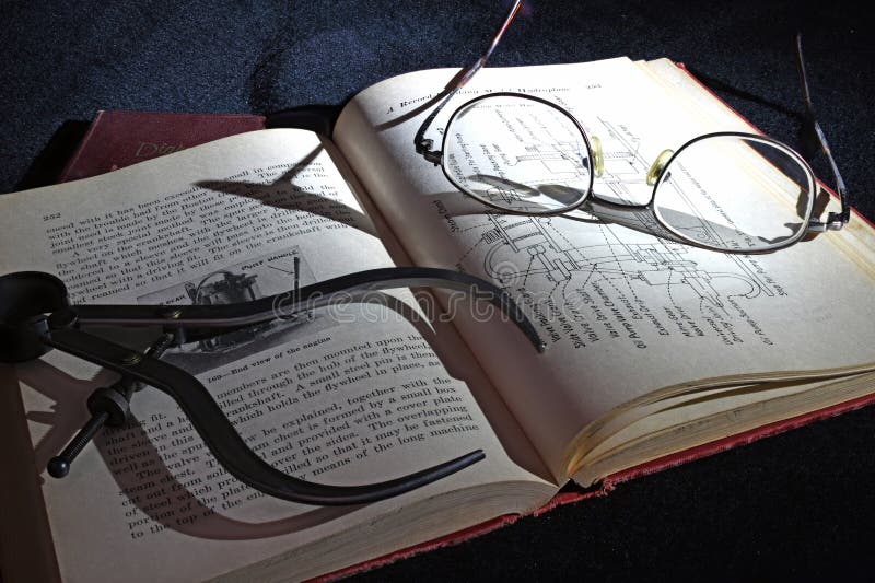 Antique Engineering Book with Calipers in Subdued Light Stock Image ...