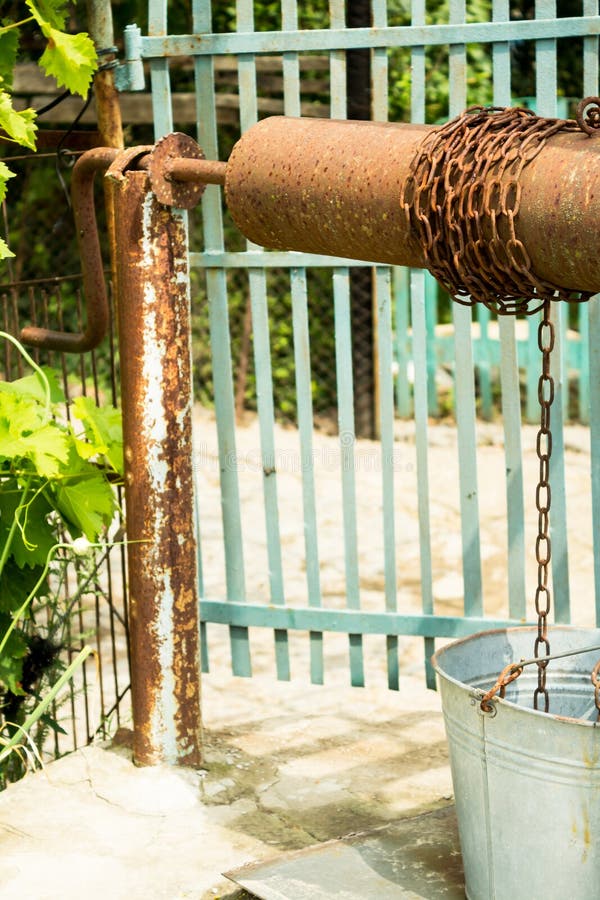 Well Water and a Bucket on a Chain Stock Image - Image of nature, hole ...