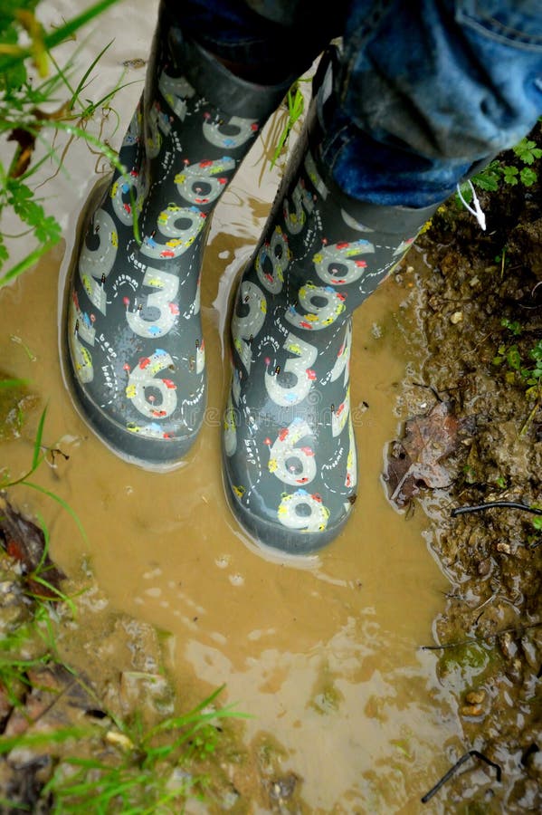 Wellington Boots in a Puddle Stock Photo - Image of youth, rain: 47821496