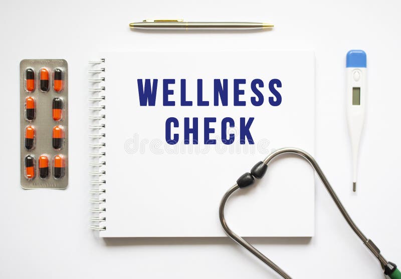 WELLNESS CHECK is Written in a Notebook on a White Table Next To Pills ...