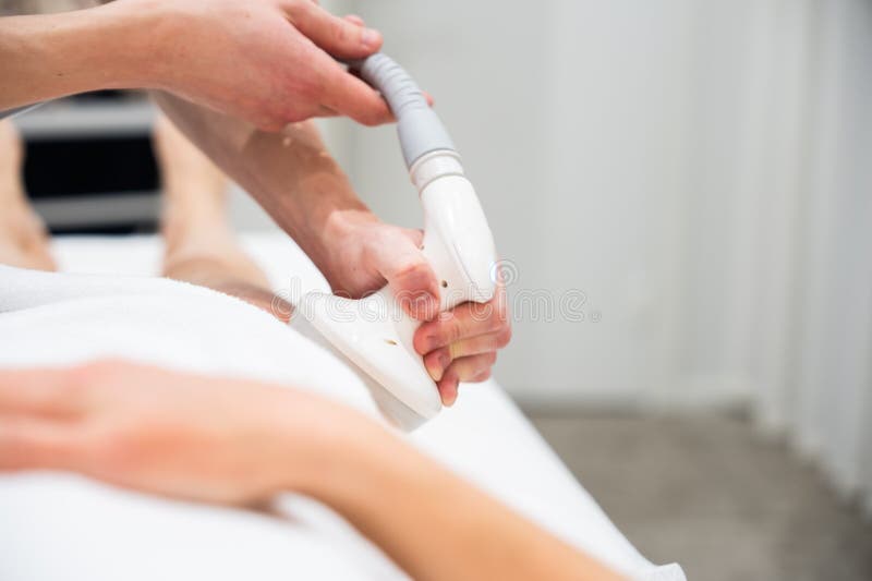 Wellness Treatment in a Spa with a Therapist Using a Device Stock Image ...