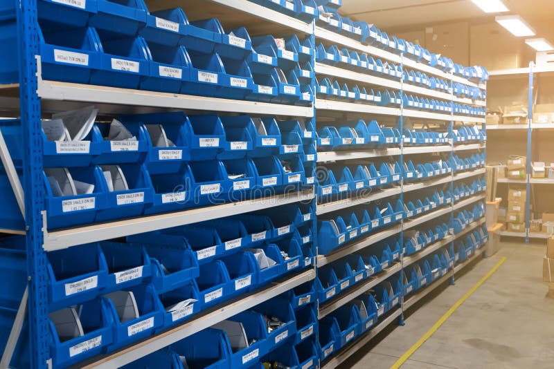 A Wellorganized Warehouse Featuring Blue Storage Bins for Improved ...