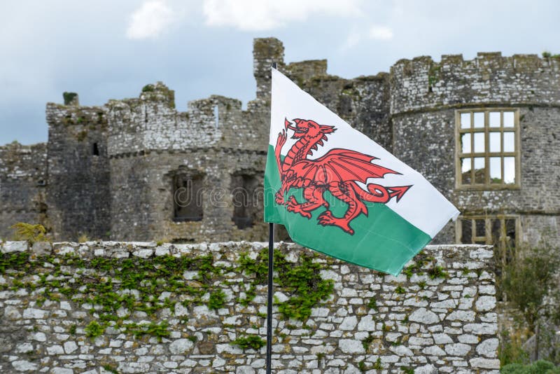 A Welsh Flag with Dragon Symbol Flying in Front of an Historic Castle ...