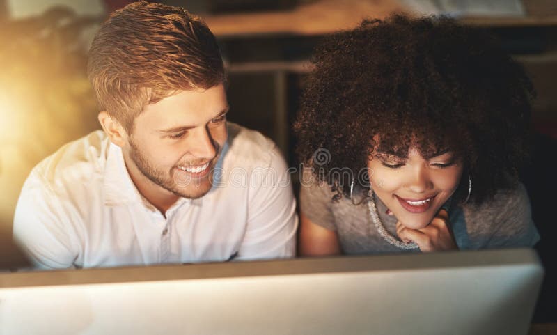 Were Making Good Progress. Shot of Colleagues Working Late at the ...