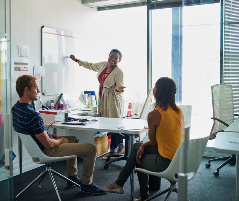 Were Making Progress. Three Colleagues Having a Meeting in an Office ...