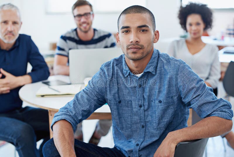 Were One Focused Team. Portrait of a Young Office Worker Sitting at a ...