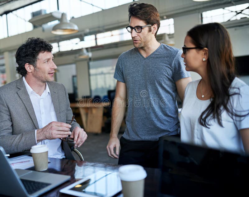 Were Ready To Get Started. Three Coworkers Talking Together in an ...