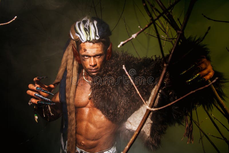 Werewolf with a Skin on His Shoulder and Long Nails among Tree B Stock ...