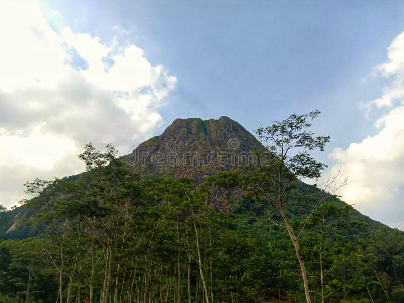 The Top of Mount Batu with the Blue Sky. Batu is Stone Editorial Stock ...
