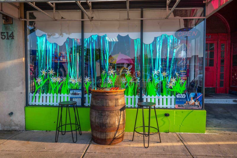Checkerboard on a Rustic Wooden Barrel and Two Stools on City Sidewalk ...