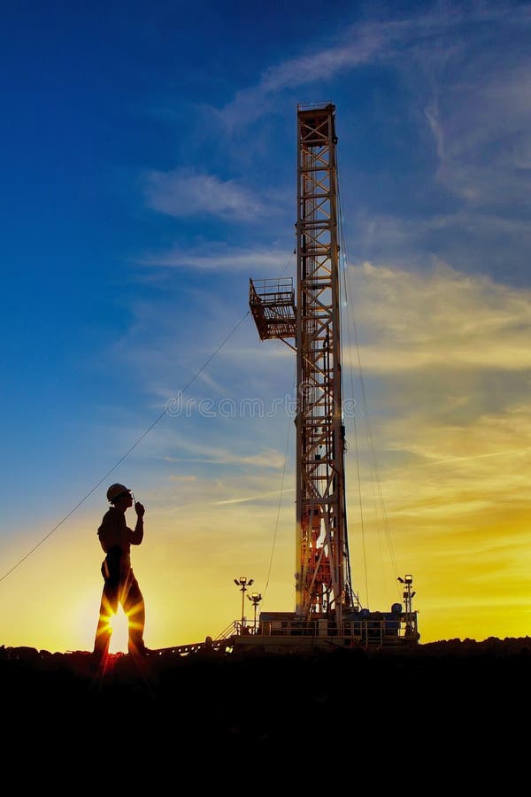 West Texas Oil Rig and Worker at Sunset Stock Image - Image of radio ...