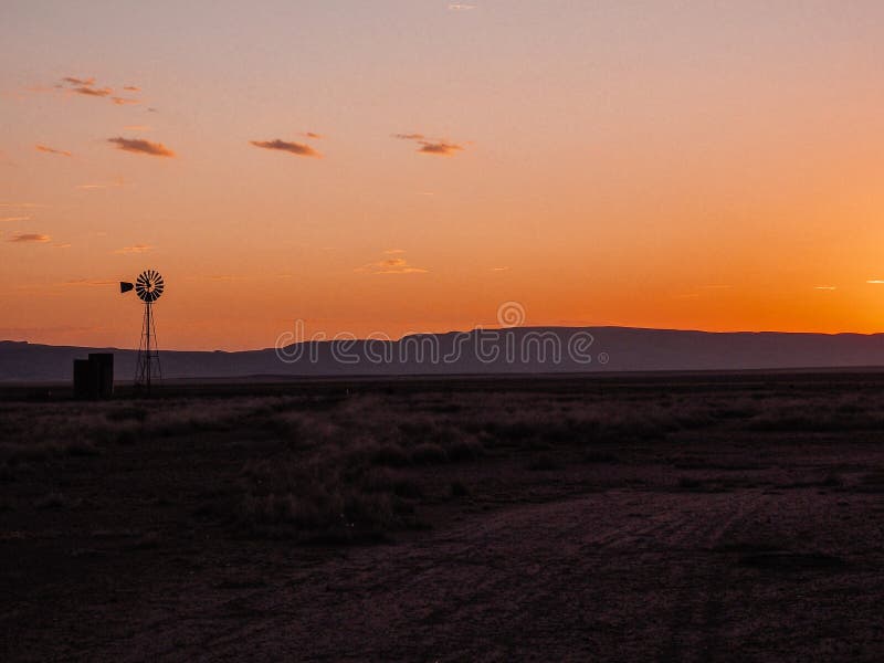 West Texas Sunset stock photo. Image of orange, windmill - 222932362