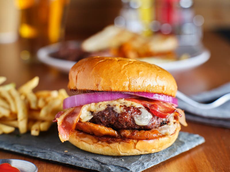 Western Style Bacon Burger with Onion Rings and Bbq Sauce Stock Photo ...