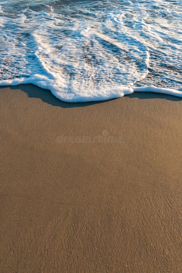Wet beach sand and ocean stock photo. Image of ripple - 172376558