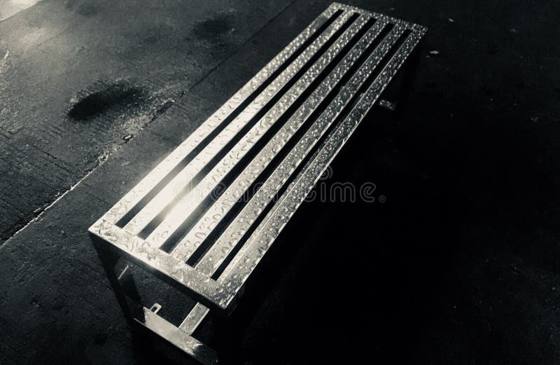 Wet bench because of rain stock photo. Image of street - 116274354