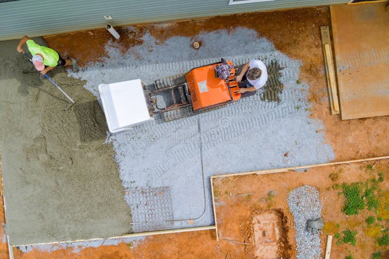 Wet Cement is Poured into Framework during Foundation Construction ...