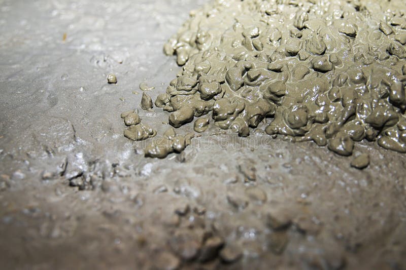 Wet Cement Spreading on a Construction Floor Surface Close-up Stock ...