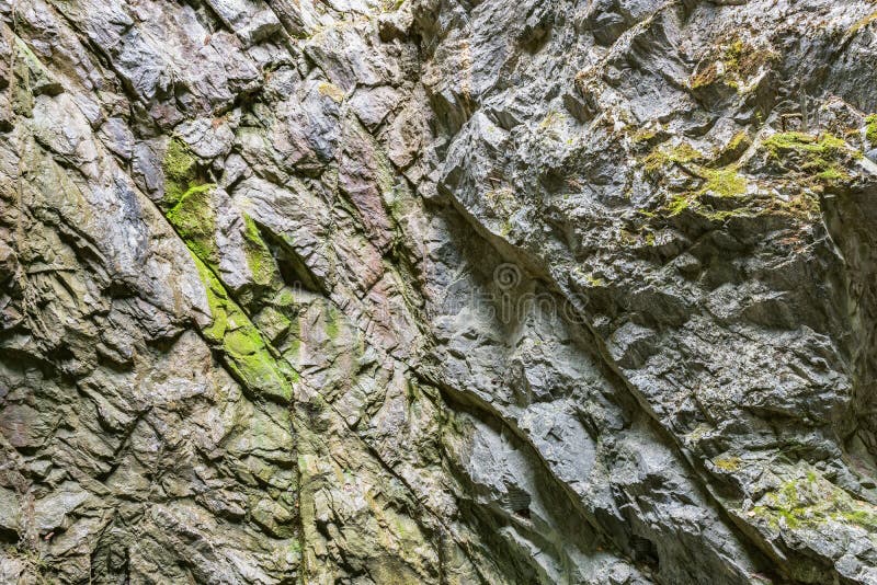 Cliff Surface, Closeup. Stones Covered with Green Moss in Some Places ...