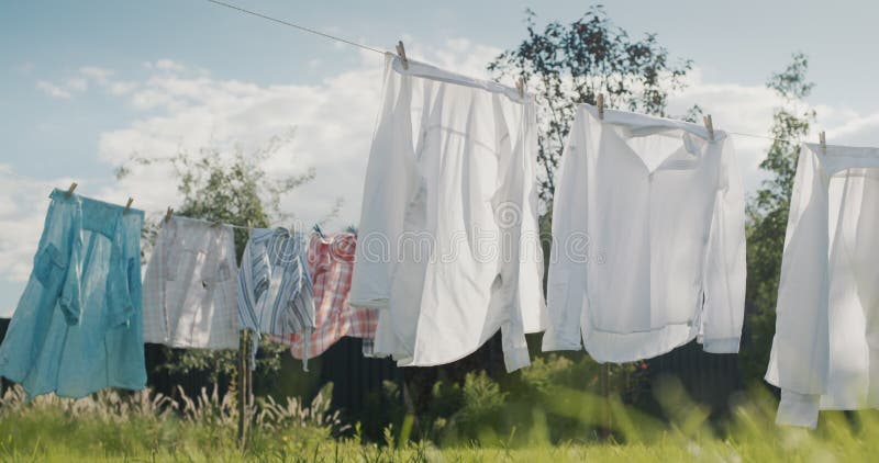 Wet Clothes Drying in the Backyard of the House Stock Footage - Video ...