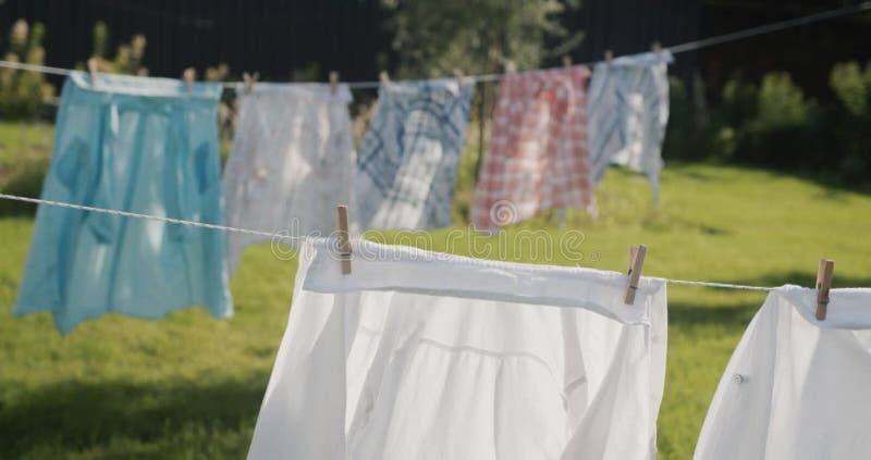 Wet Clothes Drying in the Backyard of the House Stock Video - Video of ...