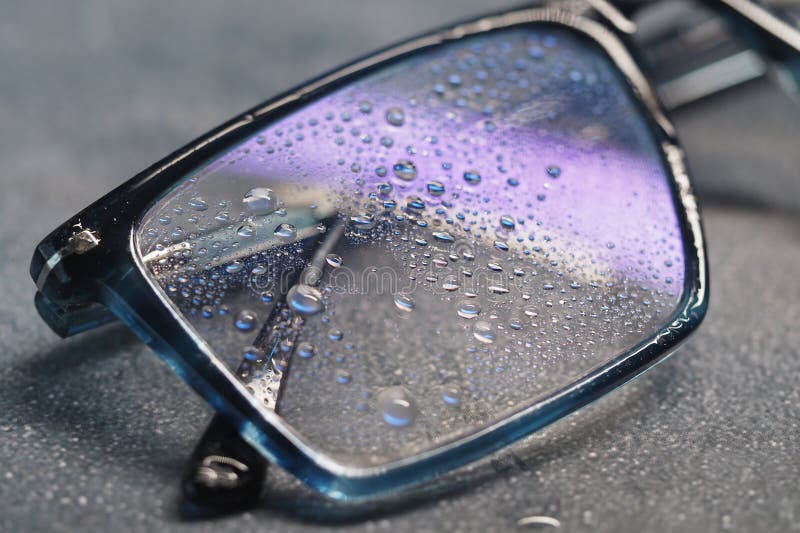 Wet Eyeglasses Resting on a Dark Surface Stock Photo - Image of optical ...