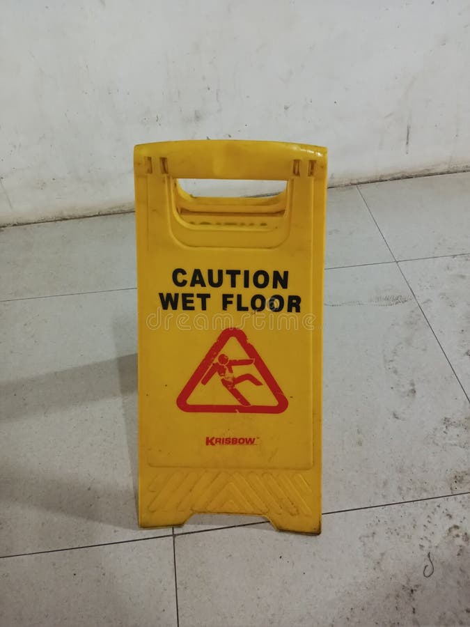 Wet Floor Caution Yellow Sign Stock Photo - Image of orange ...