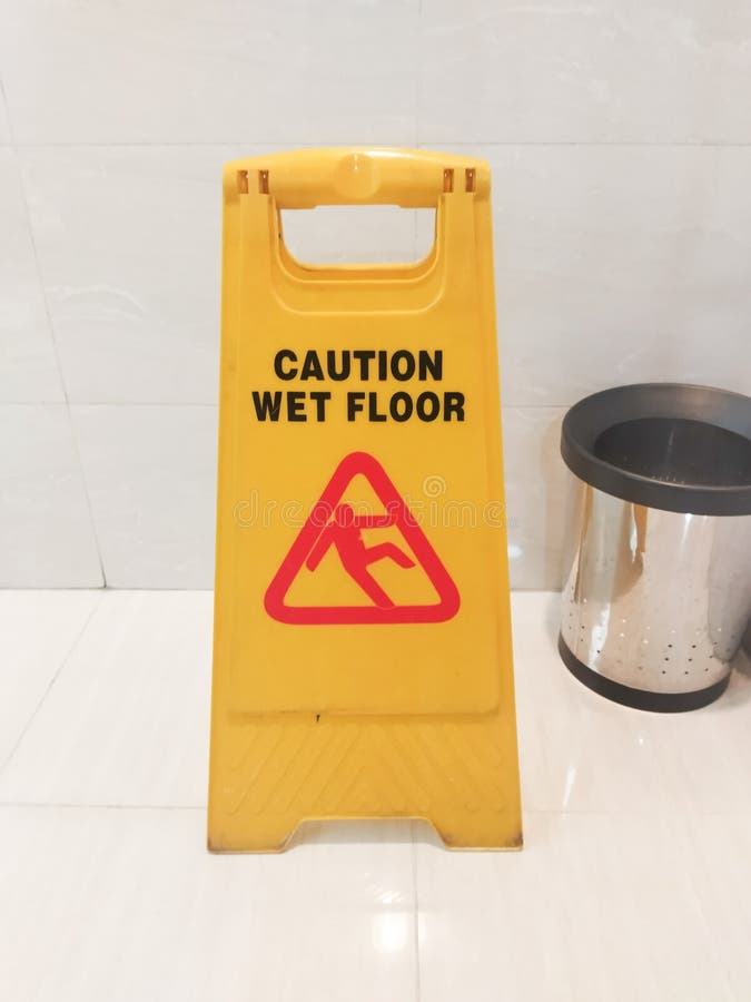 Wet Floor Notice in a Toilet Stock Photo - Image of clean, hygiene ...