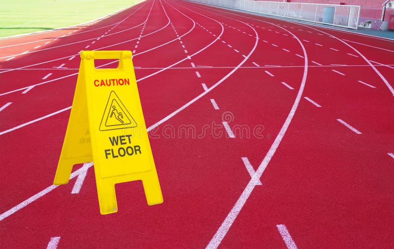 Wet Floor Sign and Running Track Stock Image - Image of sign, track ...