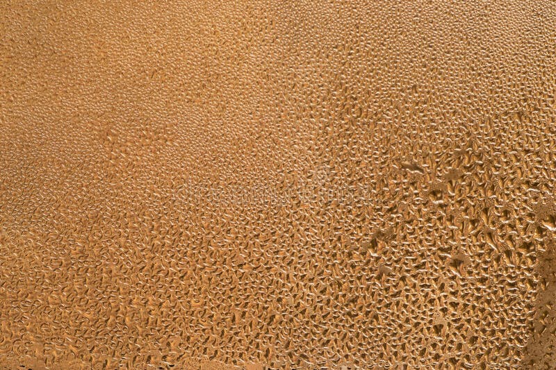 Drops are Running Down the Window. Wet Glass Brown Background. Stock ...