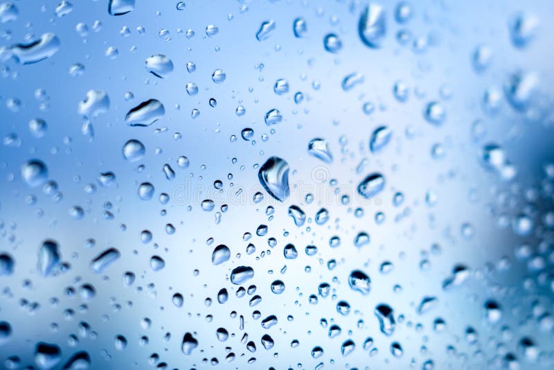 Wet Glass with Raindrops Closeup on Blue Sky Background_ Stock Image ...